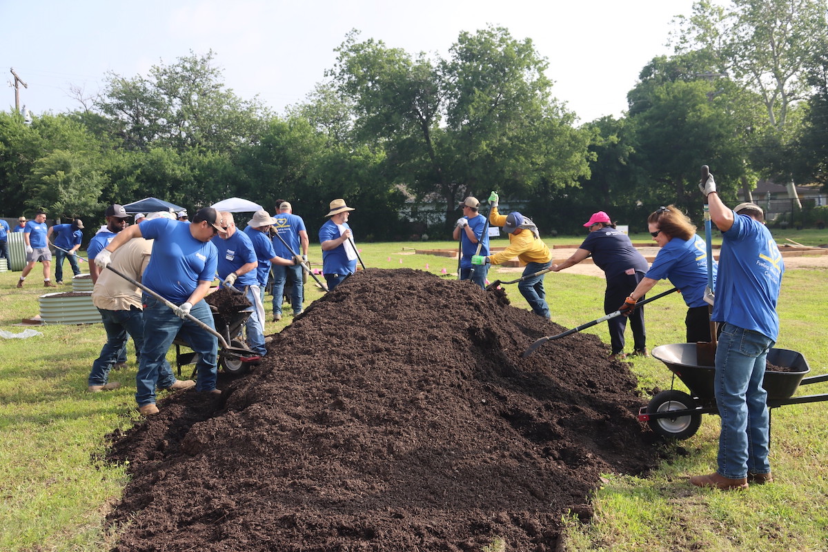 Volunteers install learning garden at Crow Academy